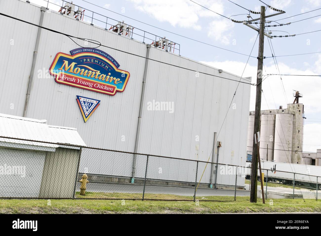 A logo sign outside of a facility occupied by Mountaire Farms in ...