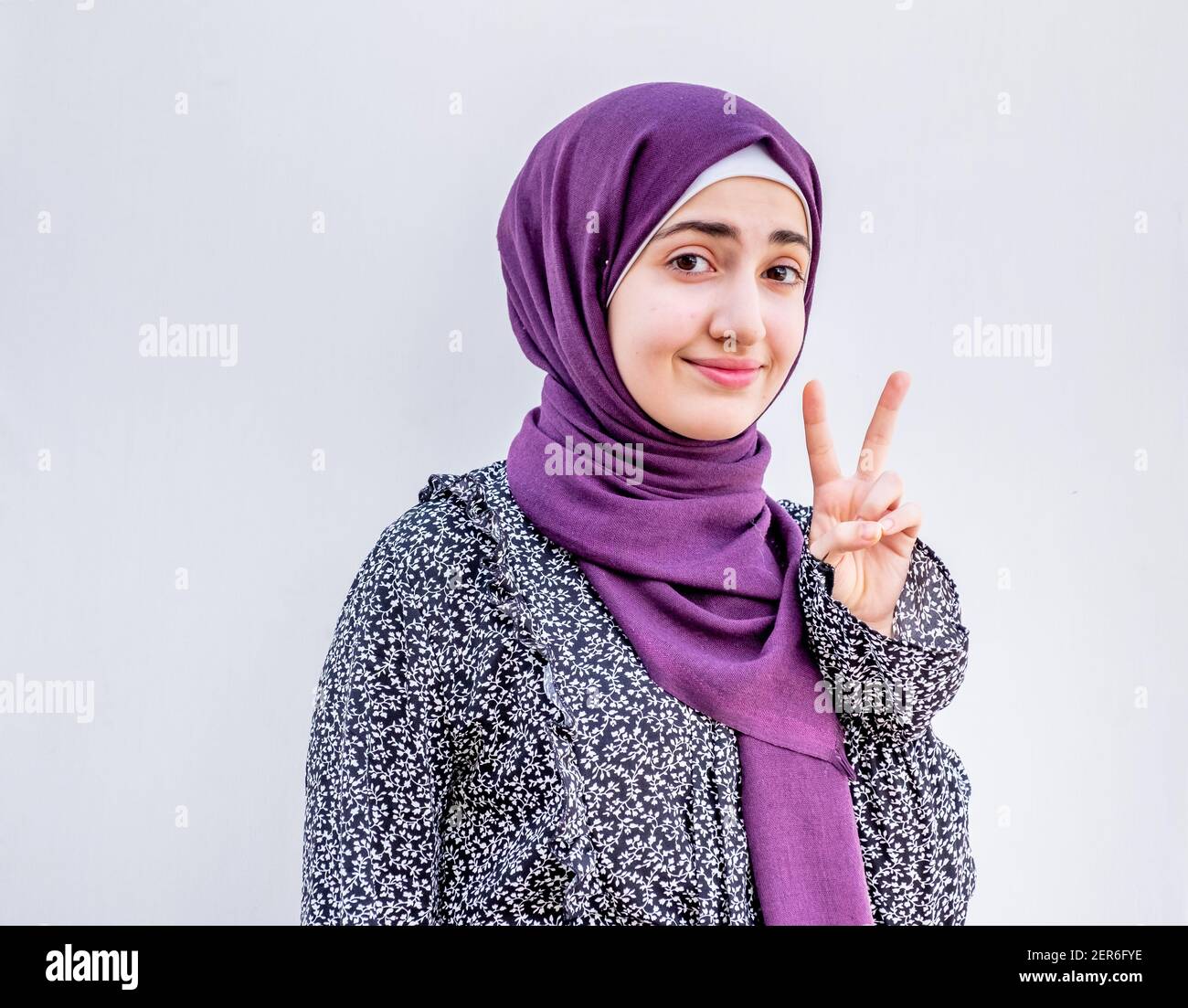 Arabic muslim girl smiling while standing Stock Photo - Alamy