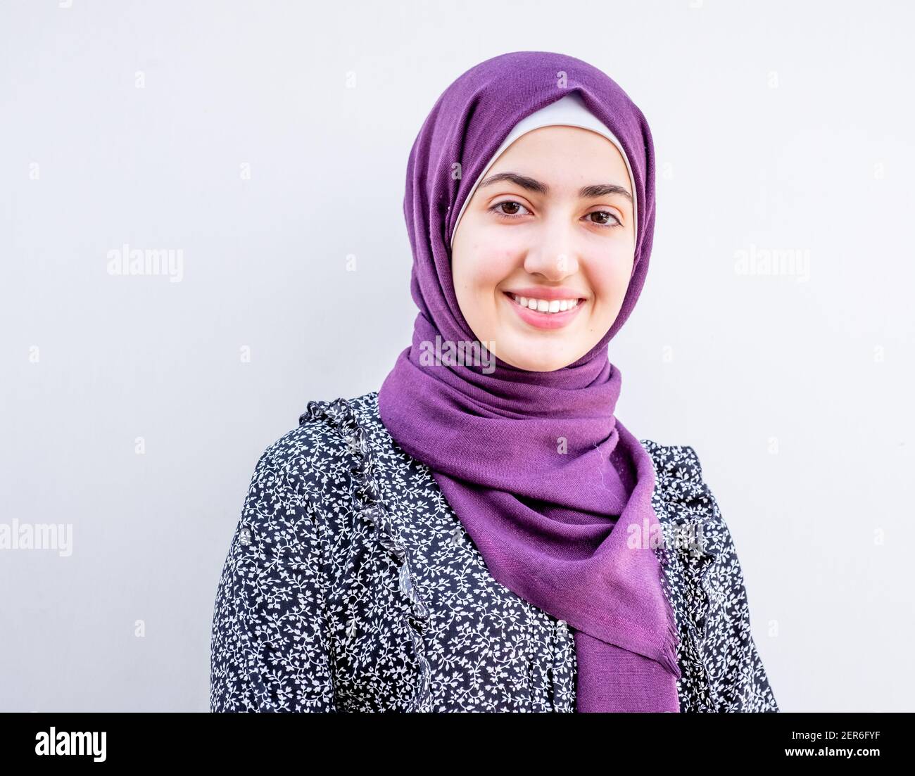 Arabic muslim girl smiling while standing Stock Photo - Alamy