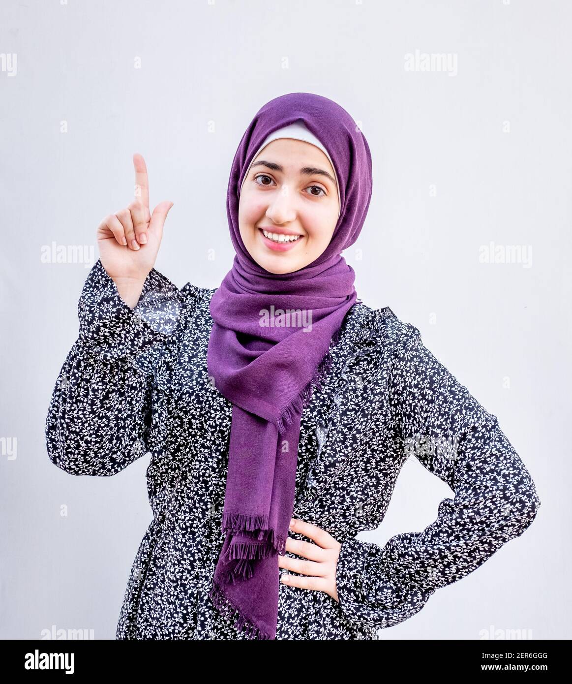 Arabic muslim girl smiling while standing Stock Photo - Alamy