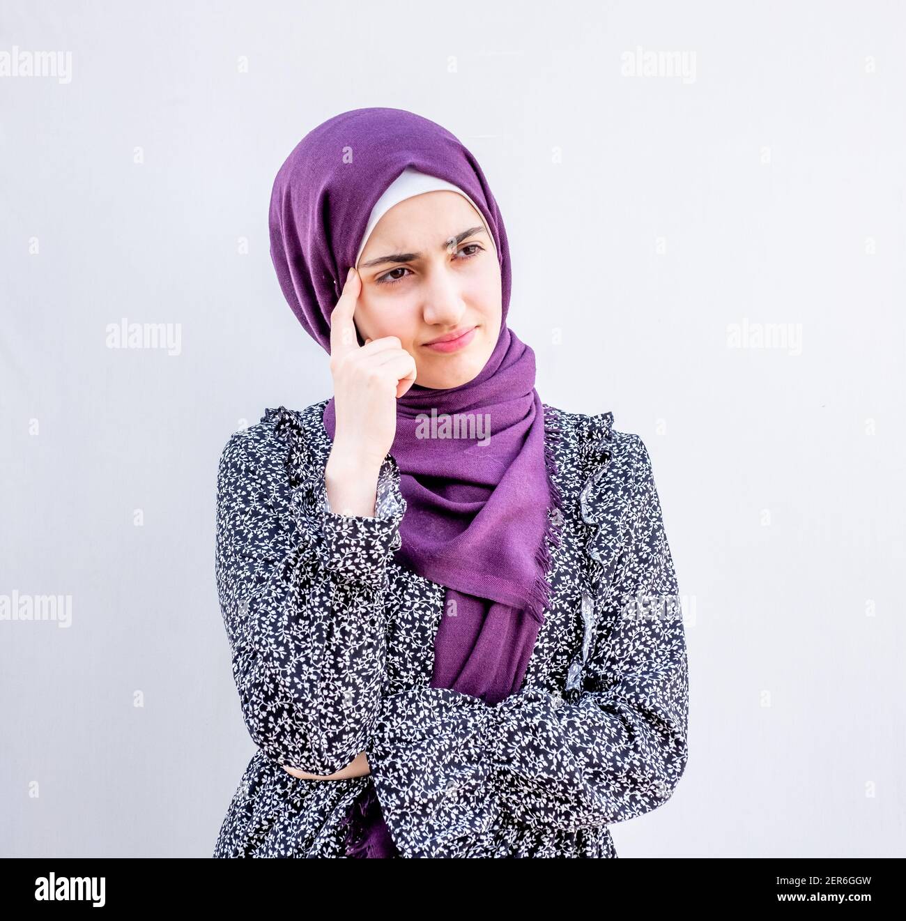 Arabic muslim girl having hard time thinking Stock Photo - Alamy