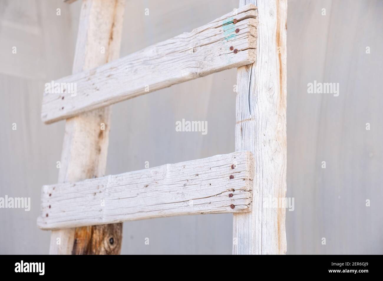 Old rustic wooden ladder needs work to use it Stock Photo - Alamy