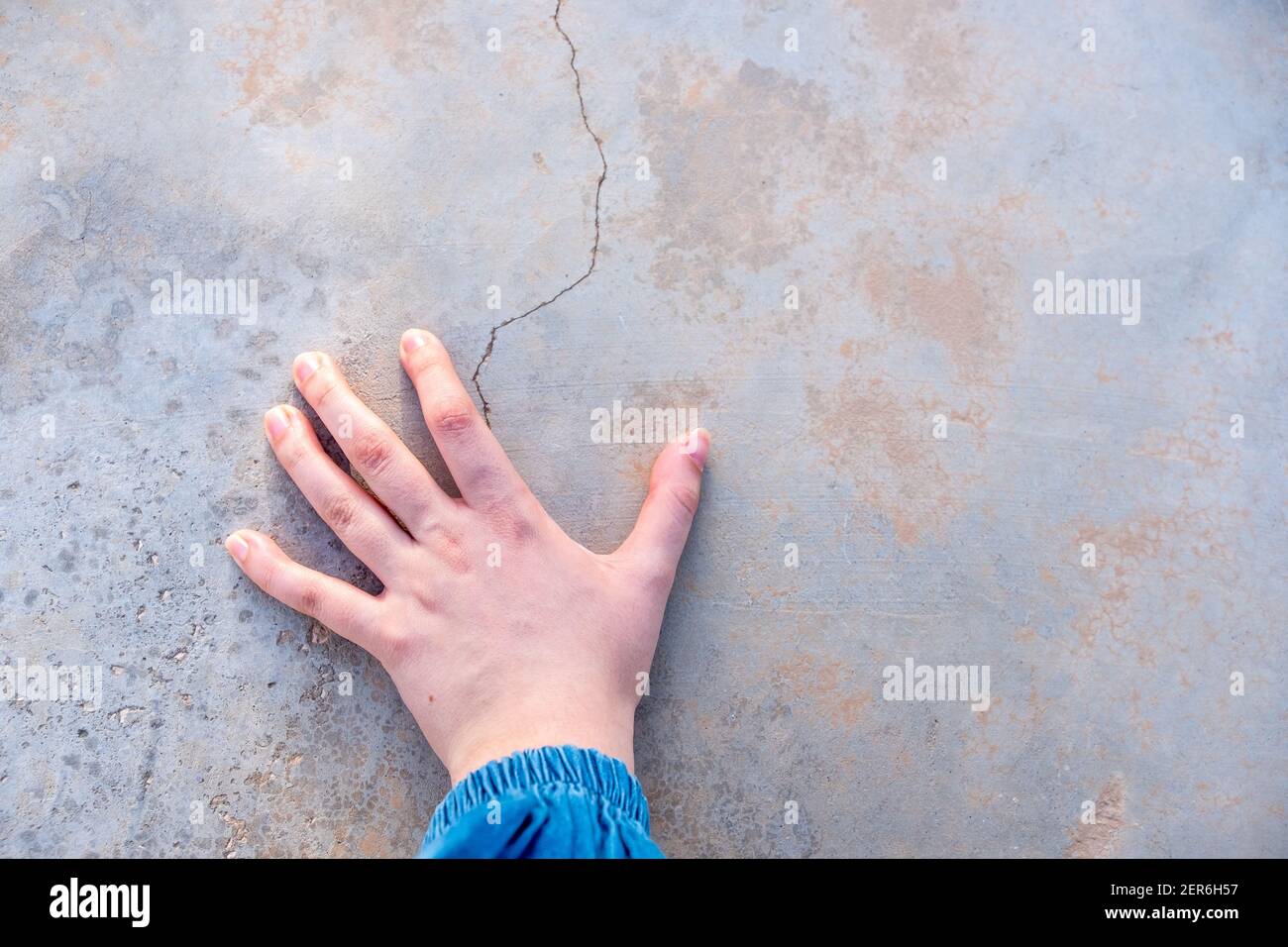 Girl punches the floor and break it with her hand Stock Photo - Alamy
