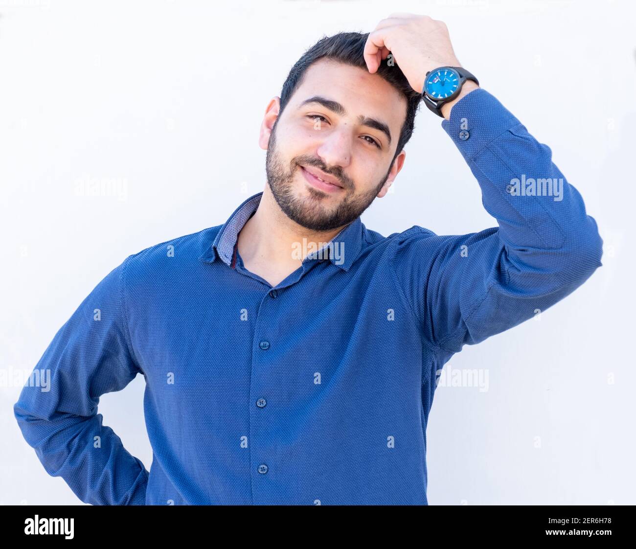 Arabic muslim guy feeling happy and smiling Stock Photo - Alamy