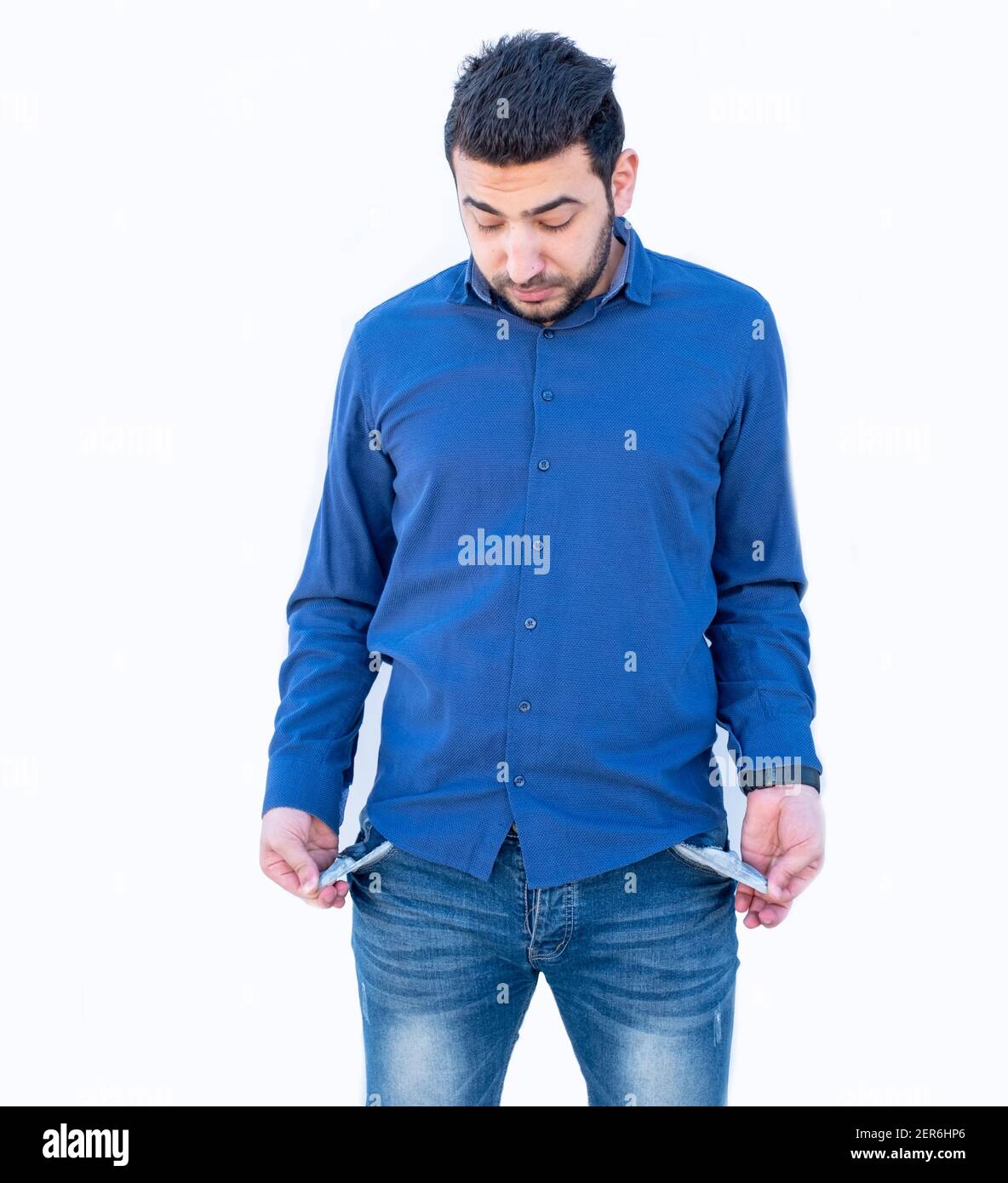 Arabic holding his wallet and pocket looking for money Stock Photo - Alamy