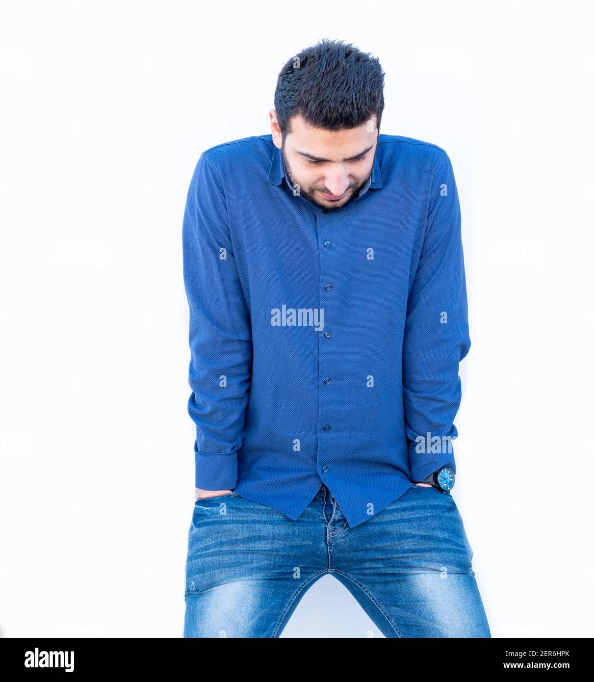 Arabic holding his wallet and pocket looking for money Stock Photo - Alamy