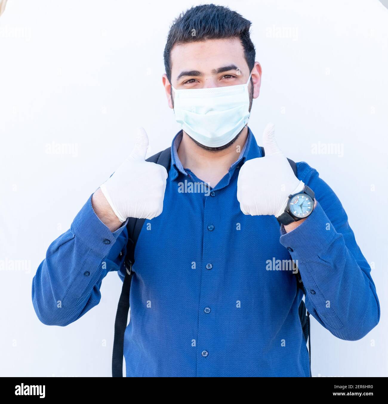 Arabic guy wearing healthy mask and smiling Stock Photo - Alamy