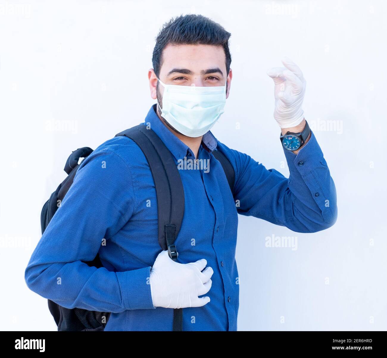 Arabic guy wearing healthy mask and smiling Stock Photo - Alamy