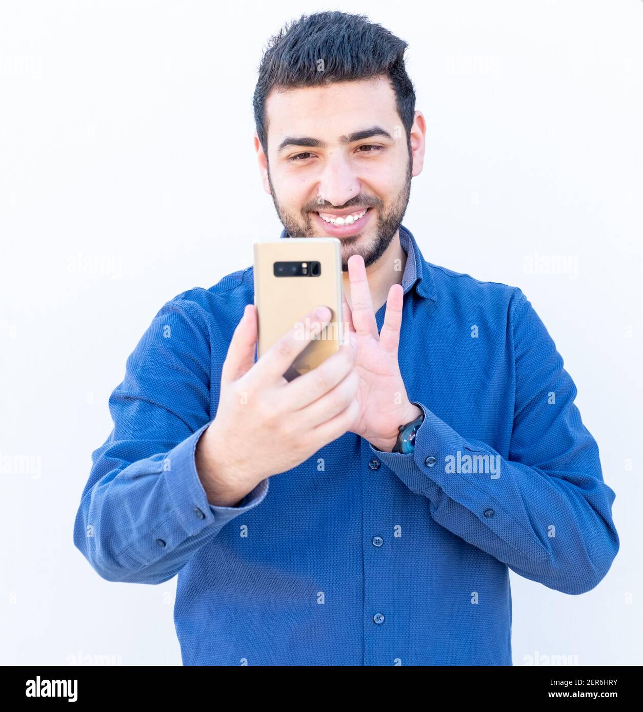 Arabic guy using mobile phone Stock Photo - Alamy