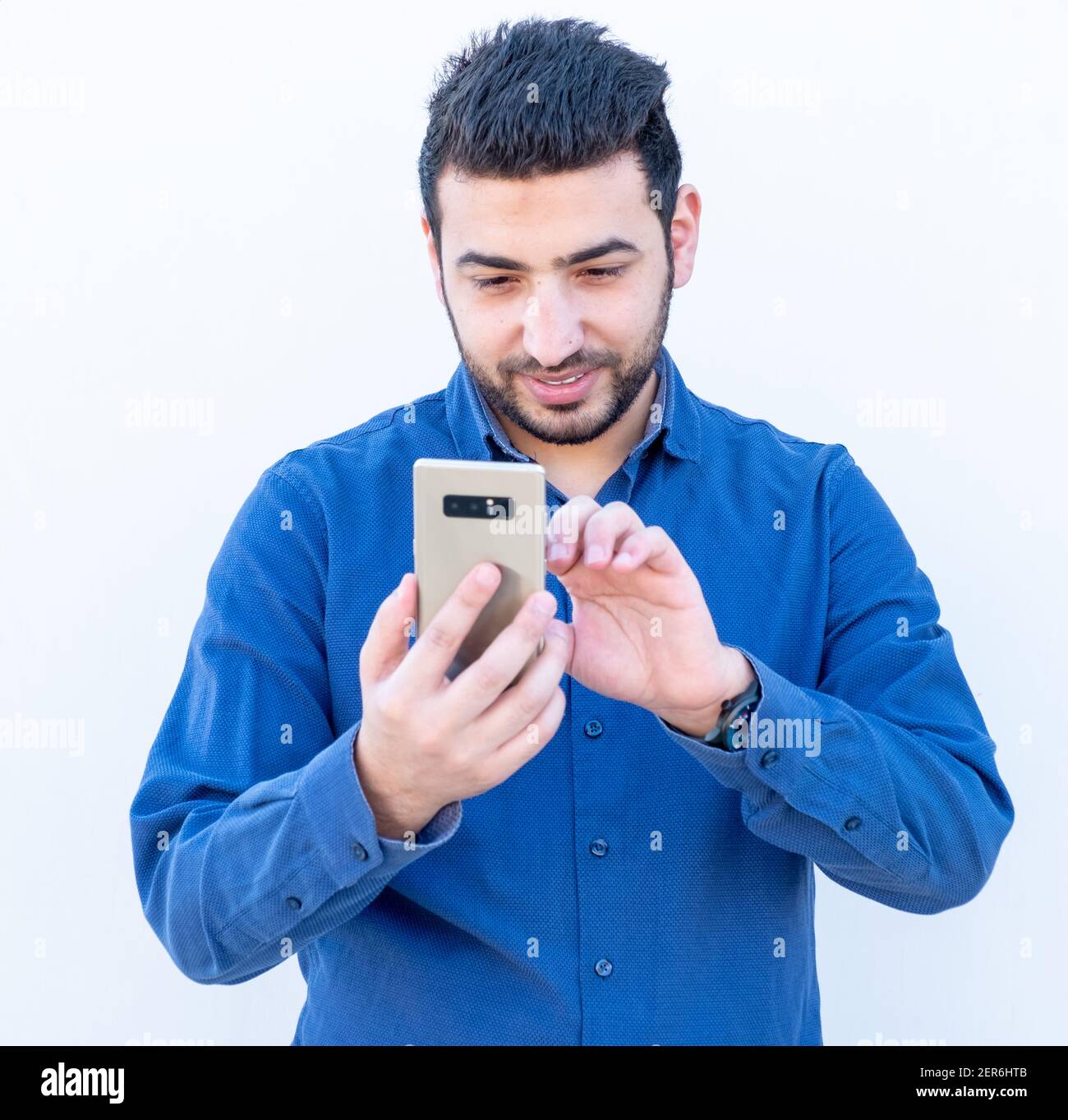 Arabic guy using mobile phone Stock Photo - Alamy