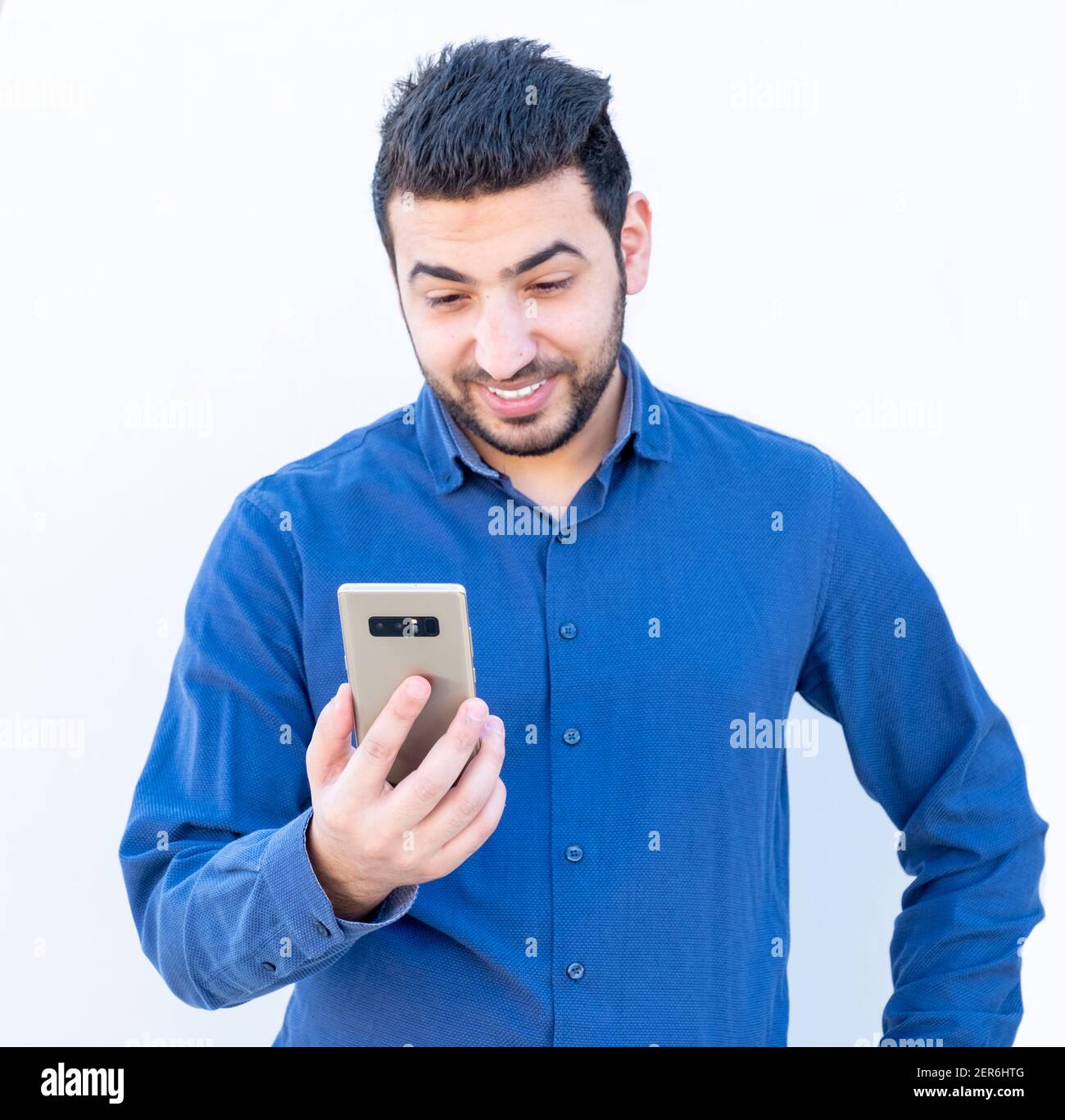Arabic guy using mobile phone Stock Photo - Alamy