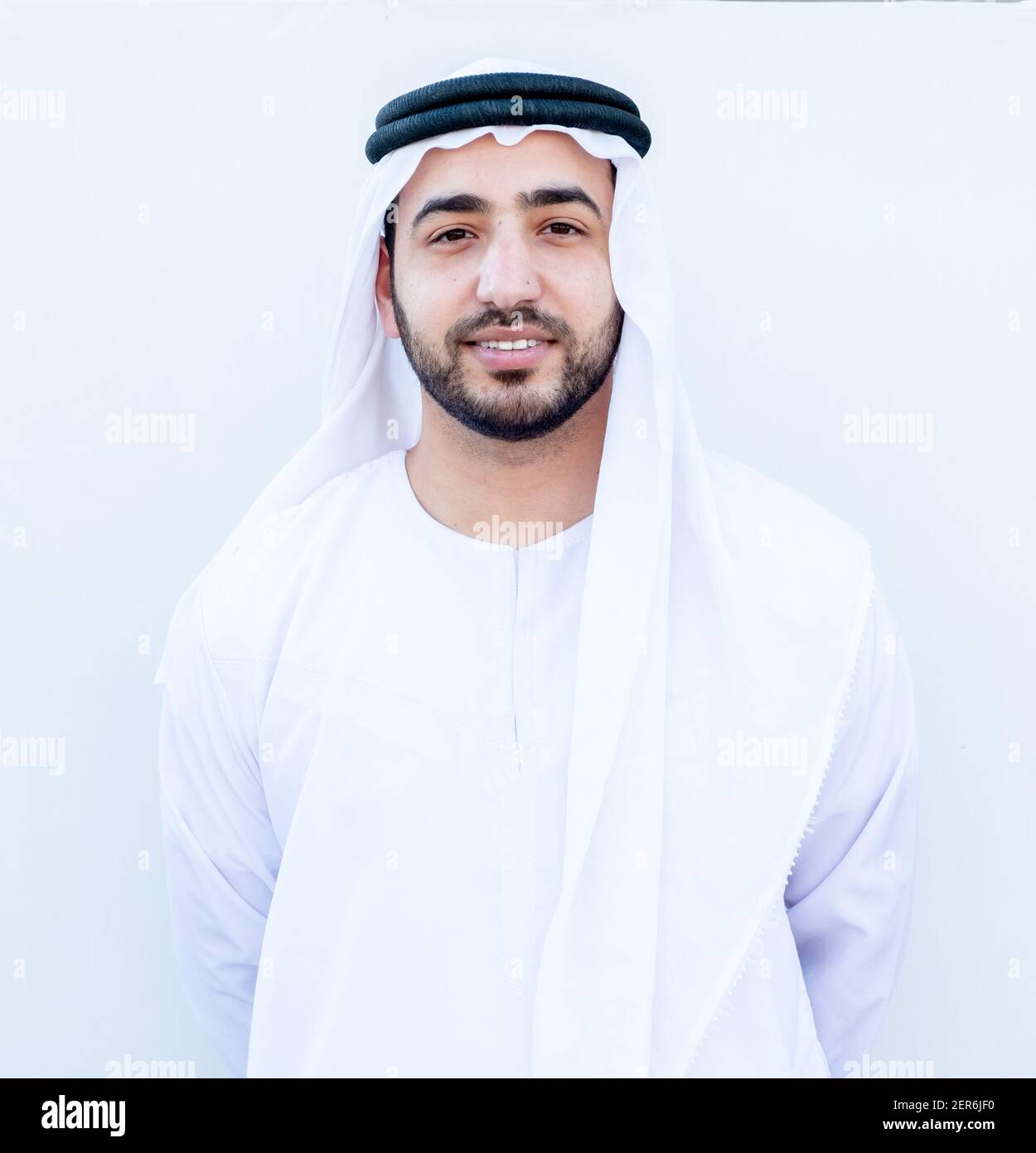 Arabic guy smiling and feeling happy Stock Photo - Alamy