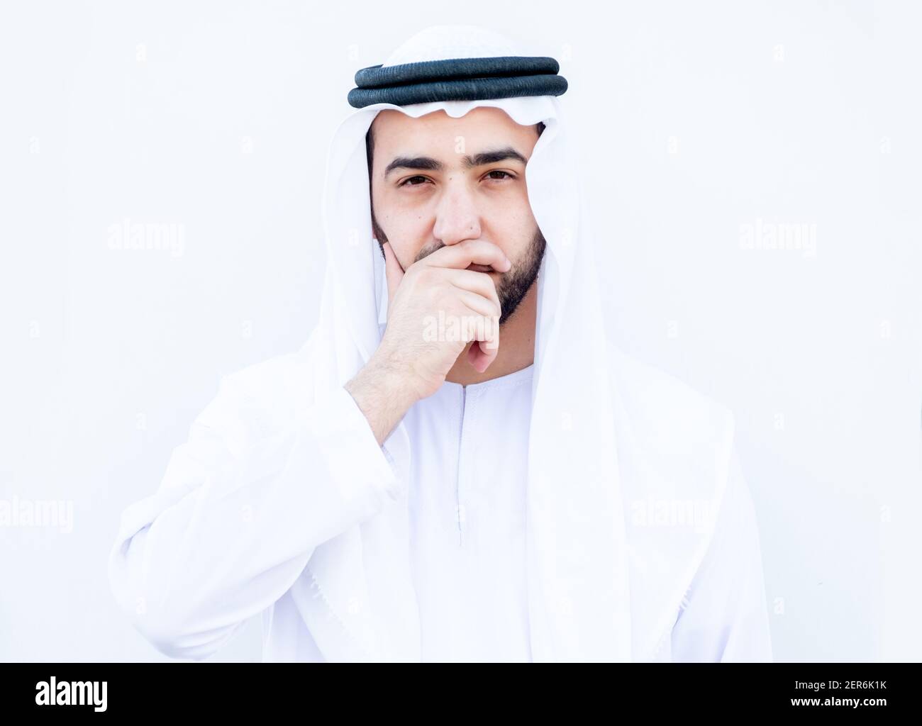 Arabic guy sitting and thinking of something Stock Photo - Alamy