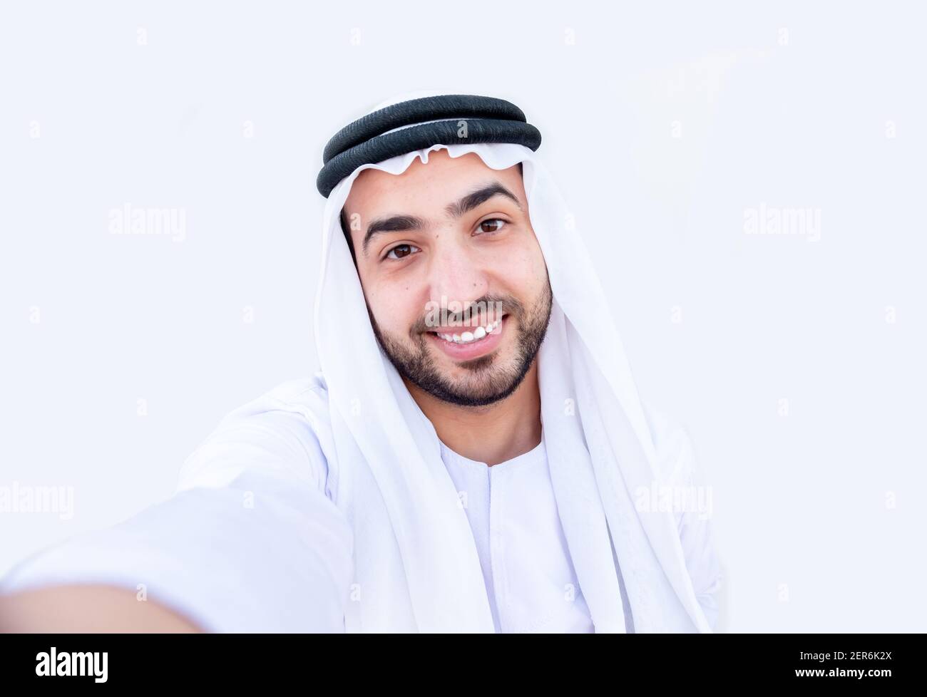 Arabic guy taking selfie and smiling Stock Photo - Alamy