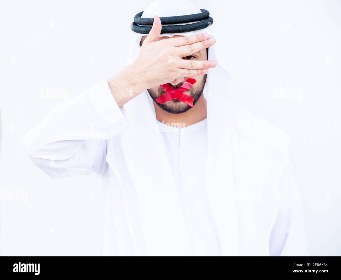 Arabic guy putting tape on his mouth as a symbol of mute Stock Photo ...
