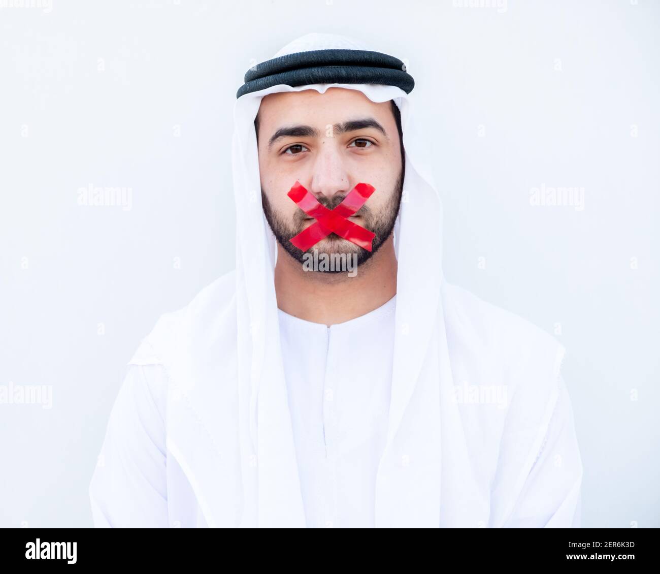 Arabic guy putting tape on his mouth as a symbol of mute Stock Photo ...