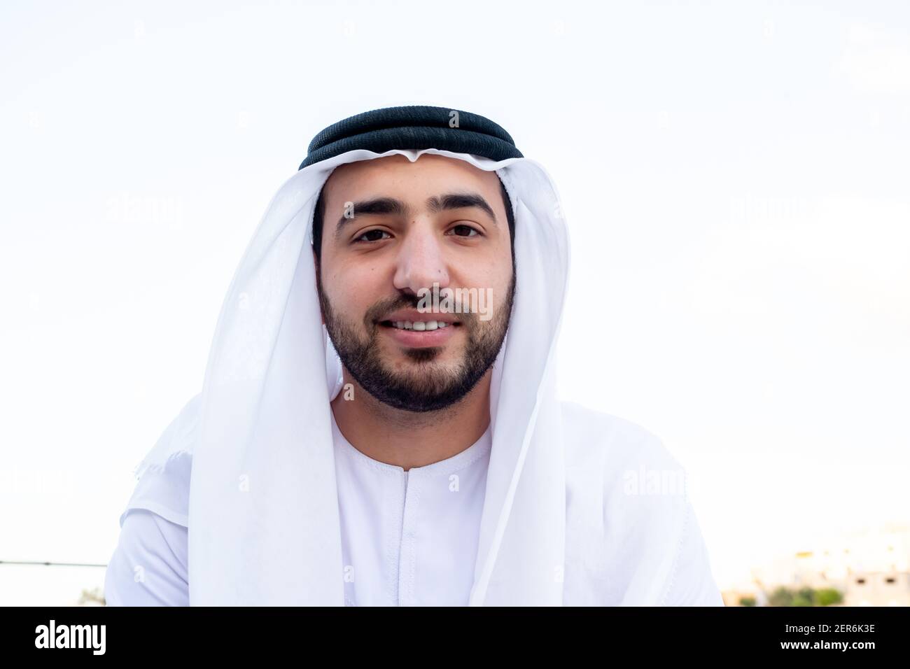 Arabic guy smiling and feeling happy Stock Photo - Alamy