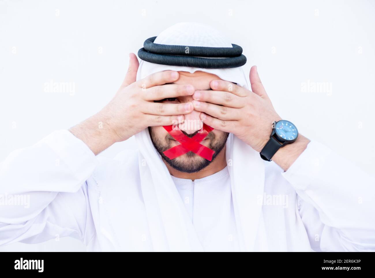 Arabic guy putting tape on his mouth as a symbol of mute Stock Photo ...