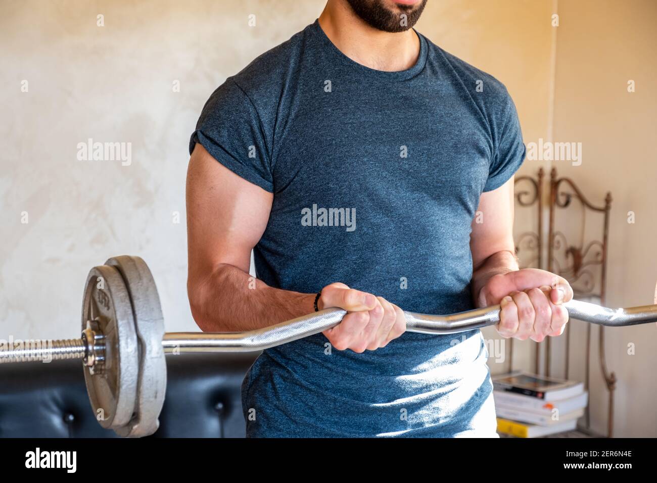 Guy doing some training at home to keep in good shape Stock Photo - Alamy