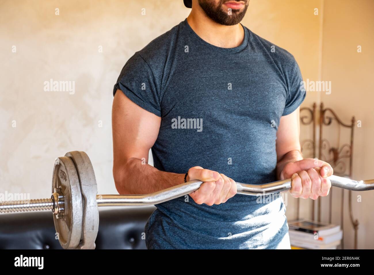 Guy doing some training at home to keep in good shape Stock Photo - Alamy