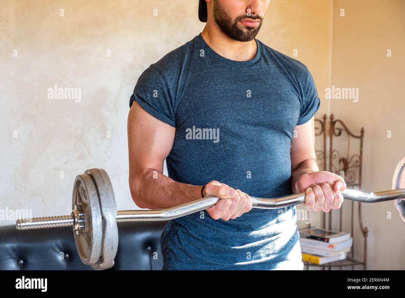 Guy doing some training at home to keep in good shape Stock Photo - Alamy