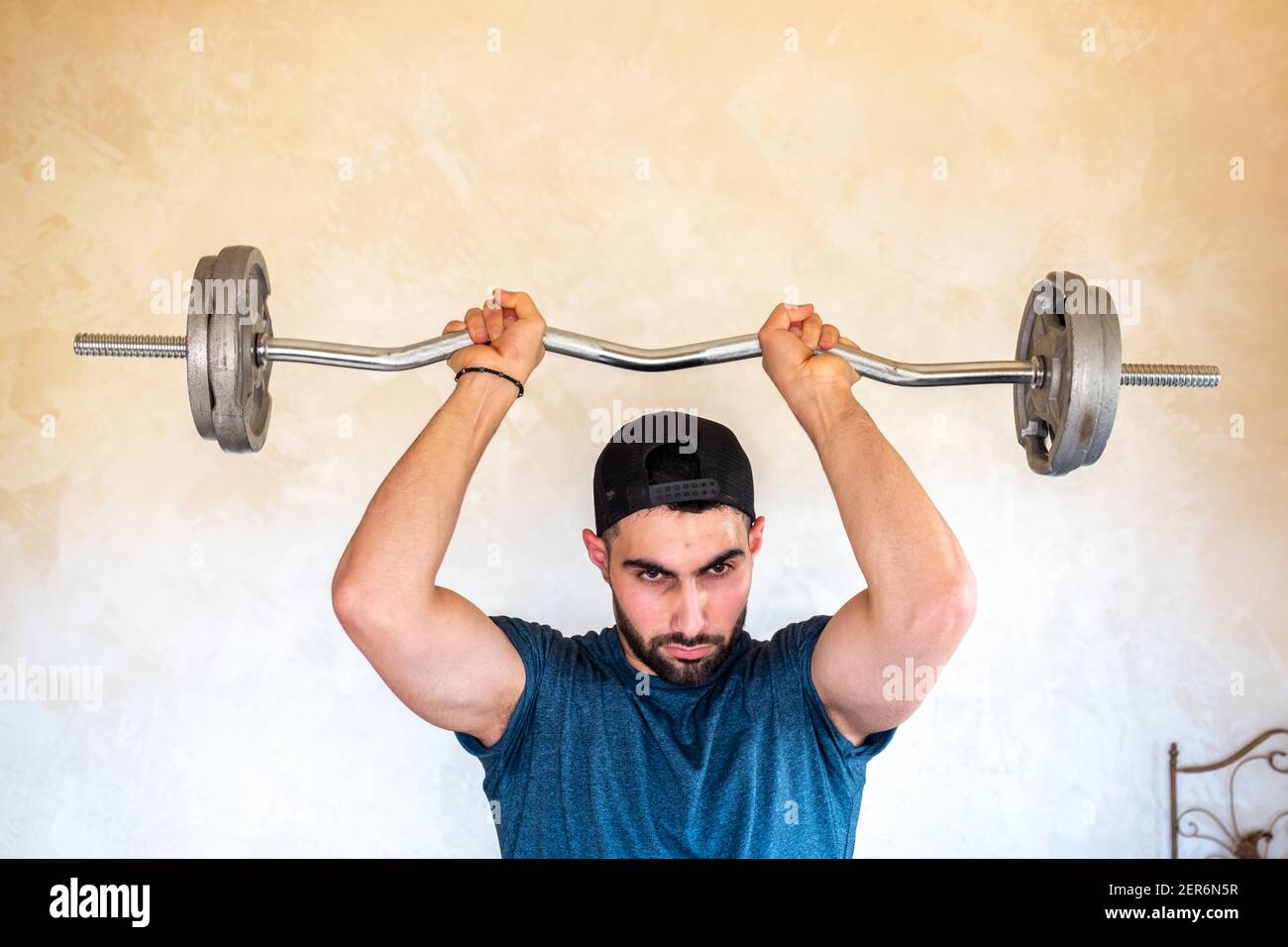 Guy doing some training at home to keep in good shape Stock Photo - Alamy