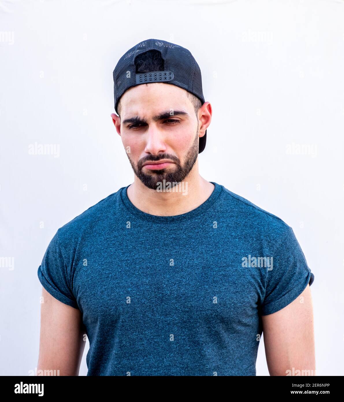 Guy making an expression of being angry and sad Stock Photo - Alamy