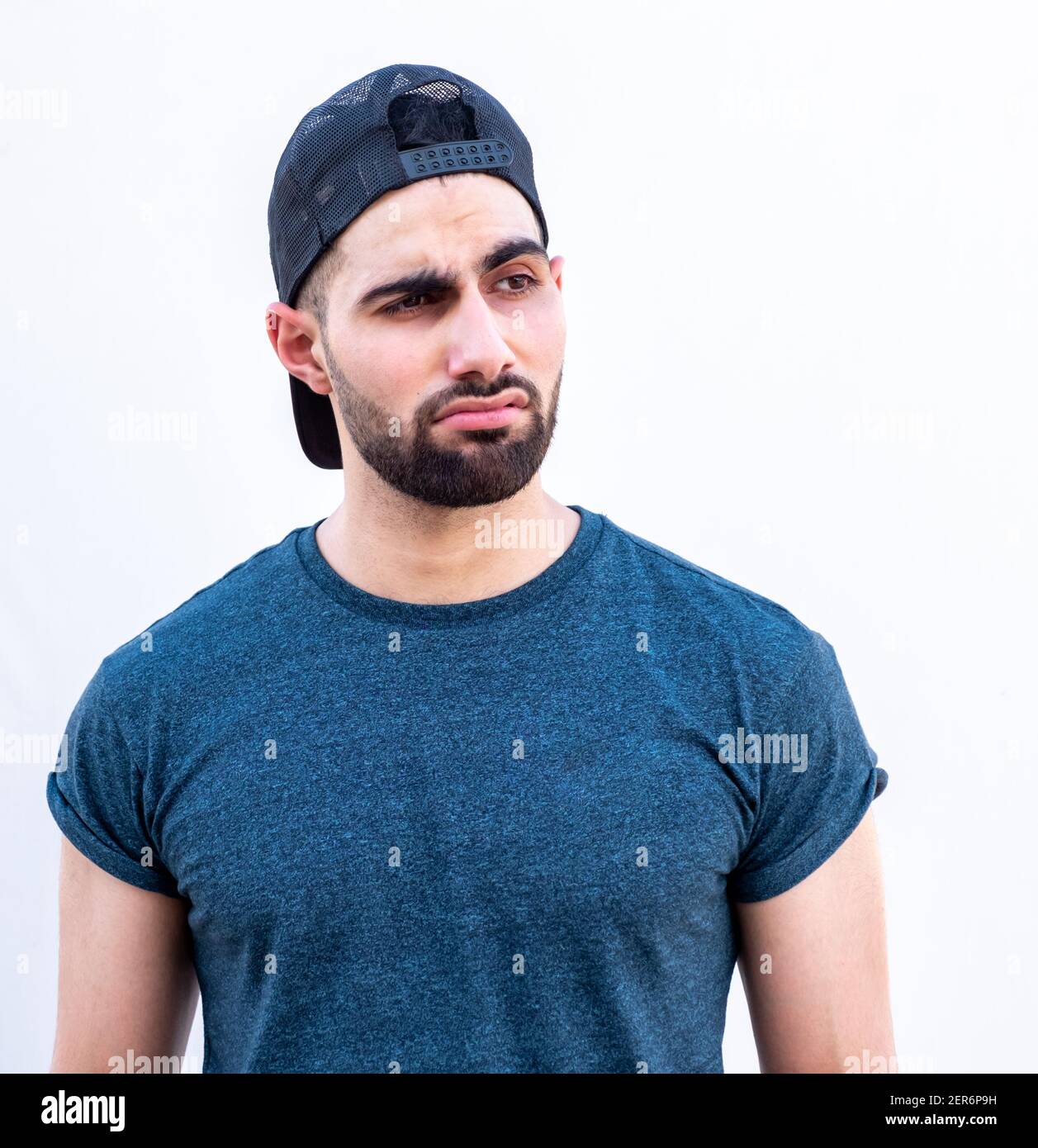 Guy making an expression of being angry and sad Stock Photo - Alamy