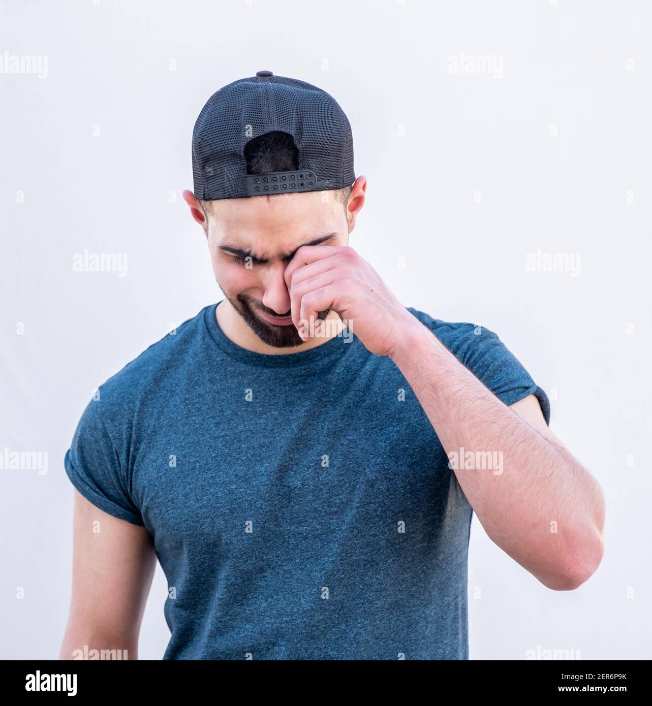 Guy making an expression of being angry and sad Stock Photo - Alamy