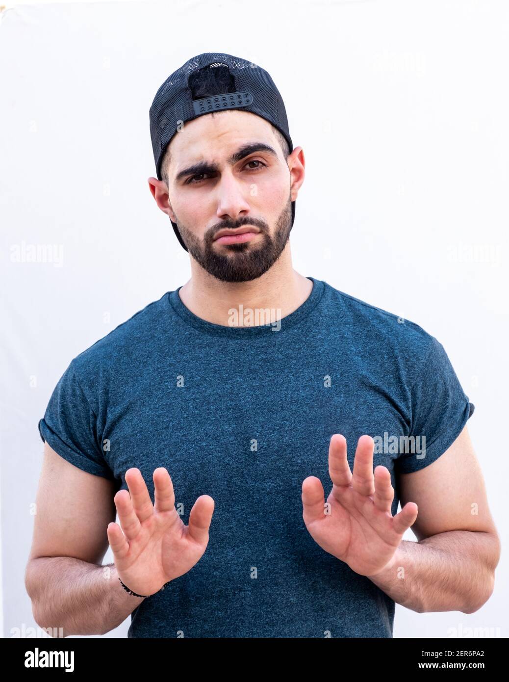 Guy making an expression of being angry and sad Stock Photo - Alamy