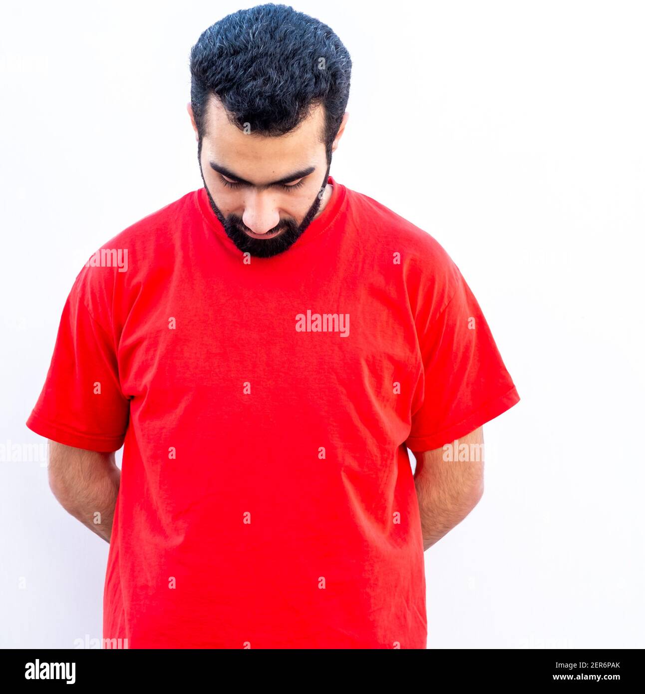 Guy making an expression of being angry and sad Stock Photo - Alamy