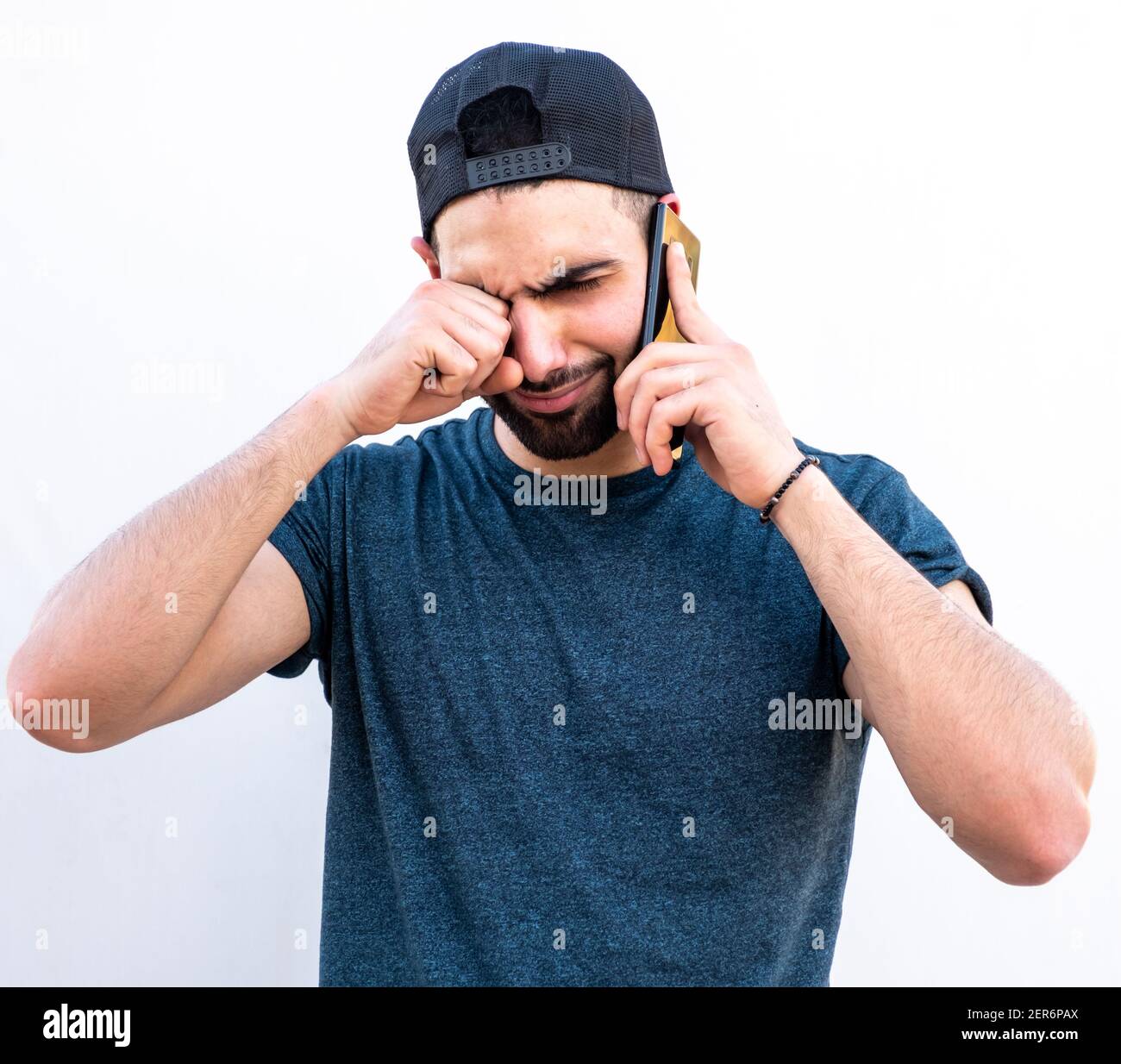 Guy making an expression of being angry and sad Stock Photo - Alamy