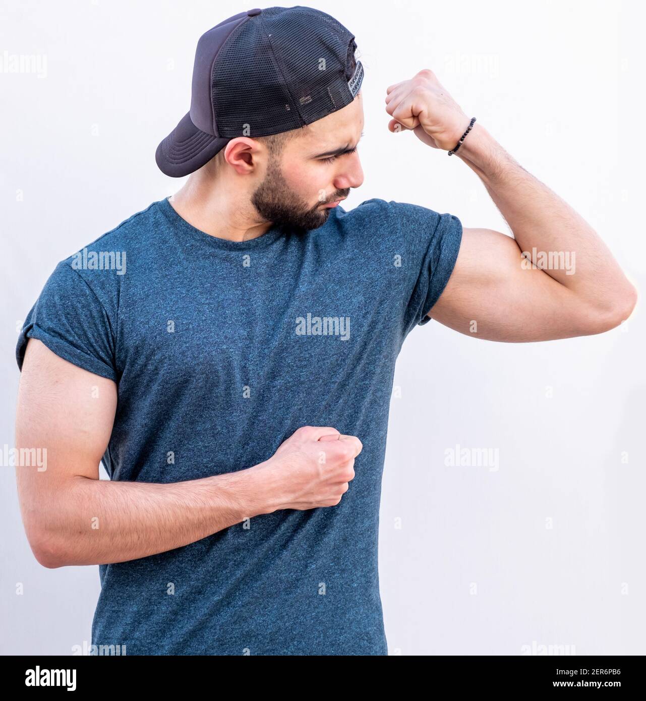 Guy pointing at his big strong hand muscle Stock Photo - Alamy