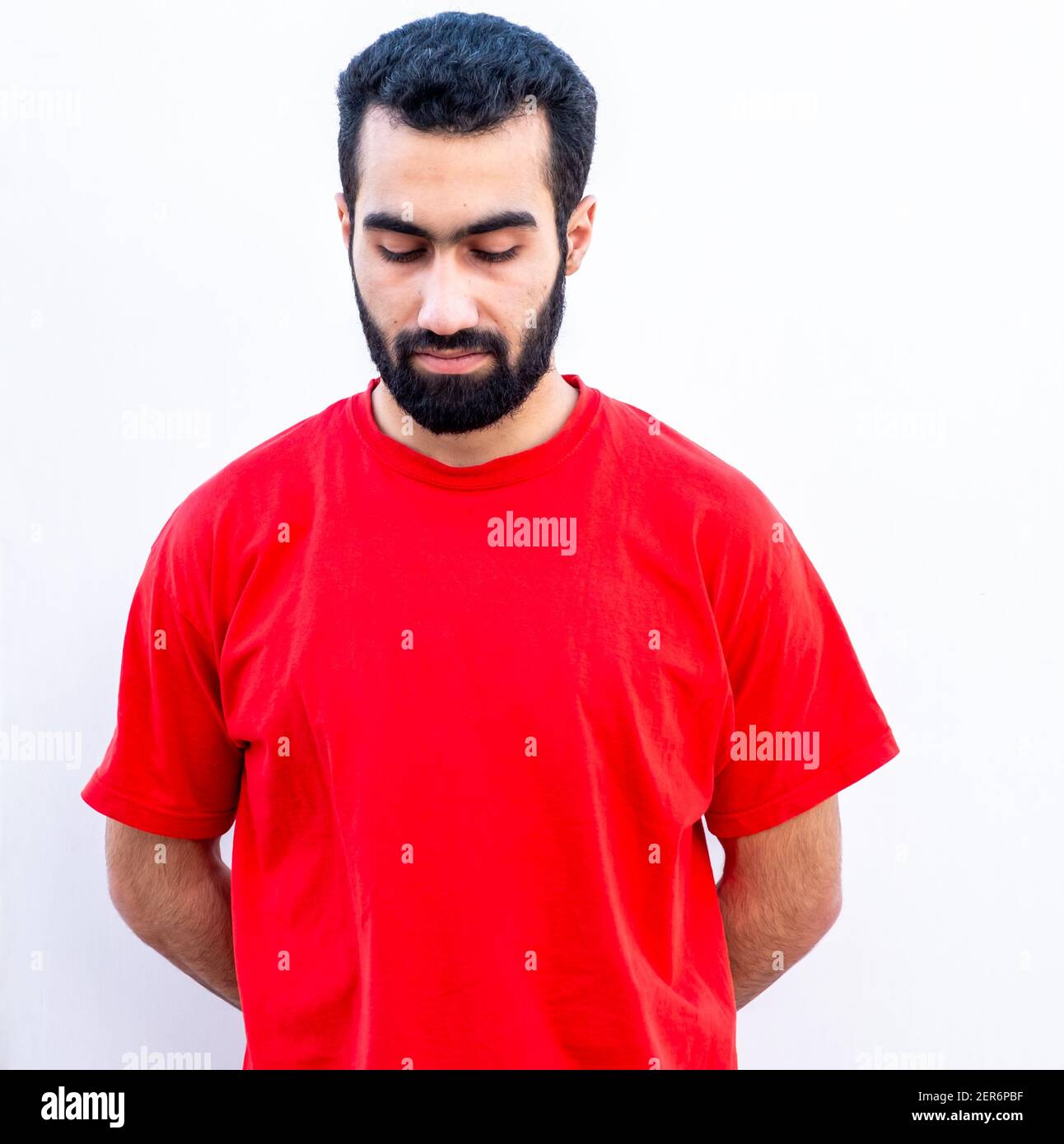 Guy making an expression of being angry and sad Stock Photo - Alamy