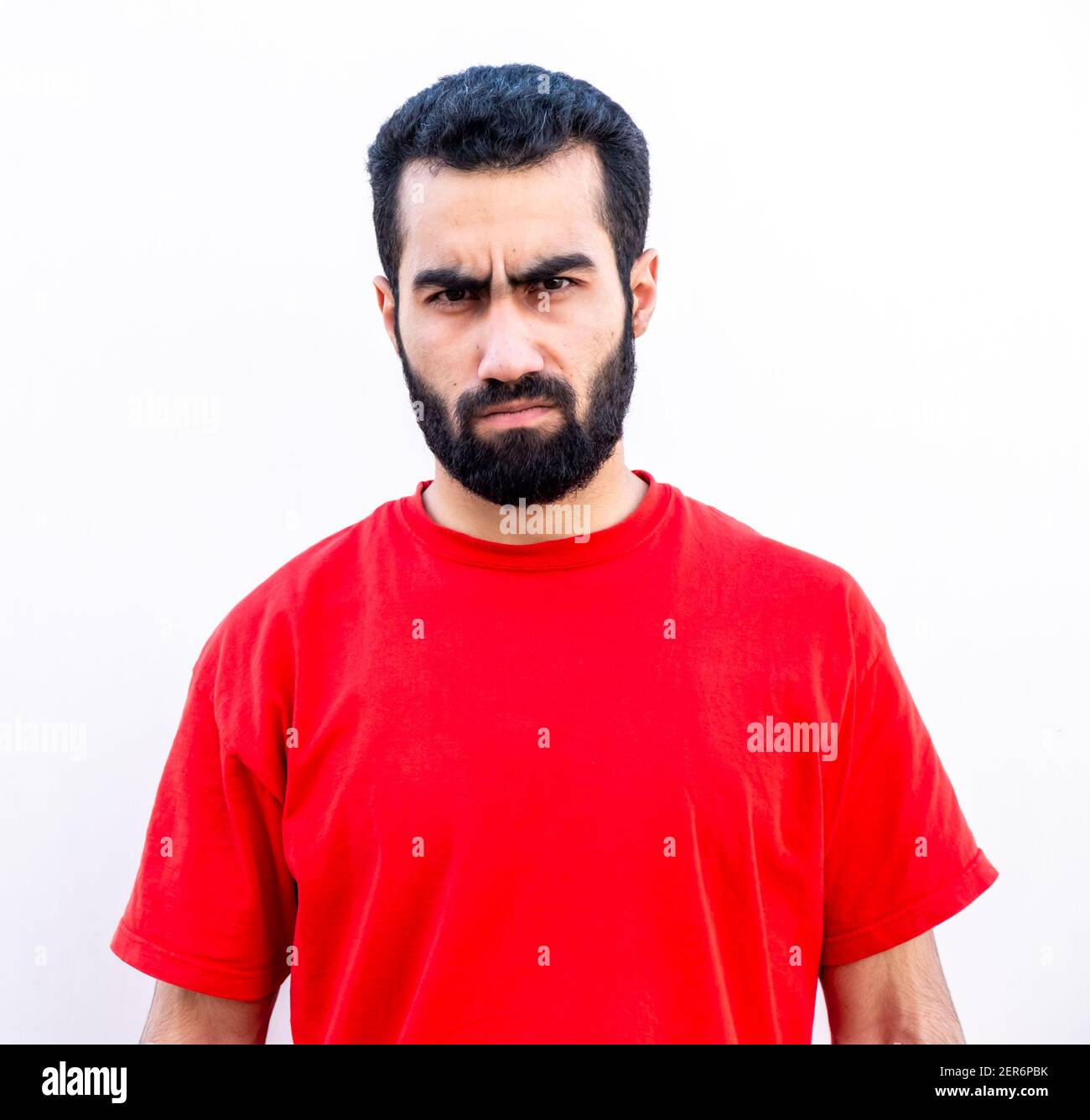 Guy making an expression of being angry and sad Stock Photo - Alamy