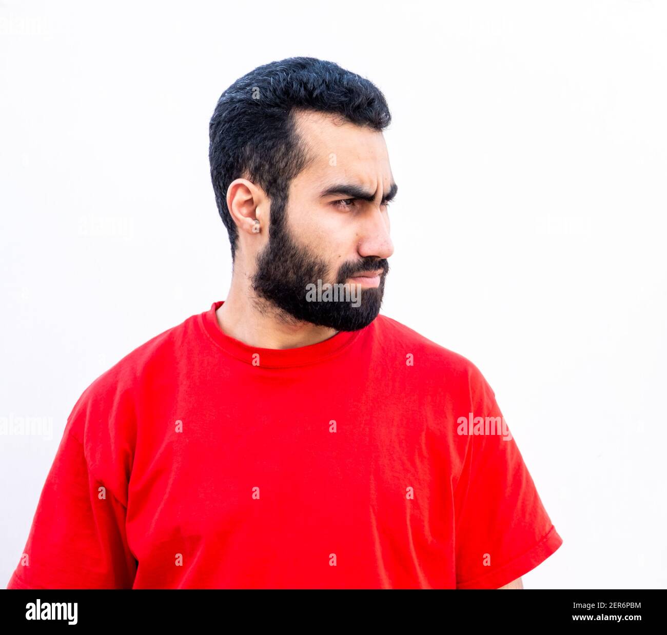 Guy making an expression of being angry and sad Stock Photo - Alamy