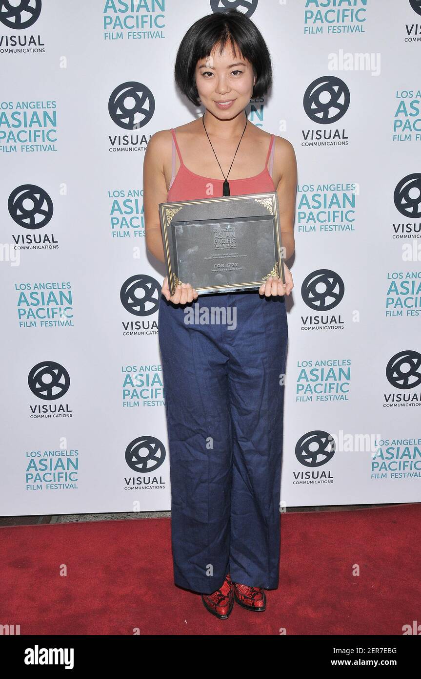 Actress Michelle Ang holding the award in which her film "For Izzy ...
