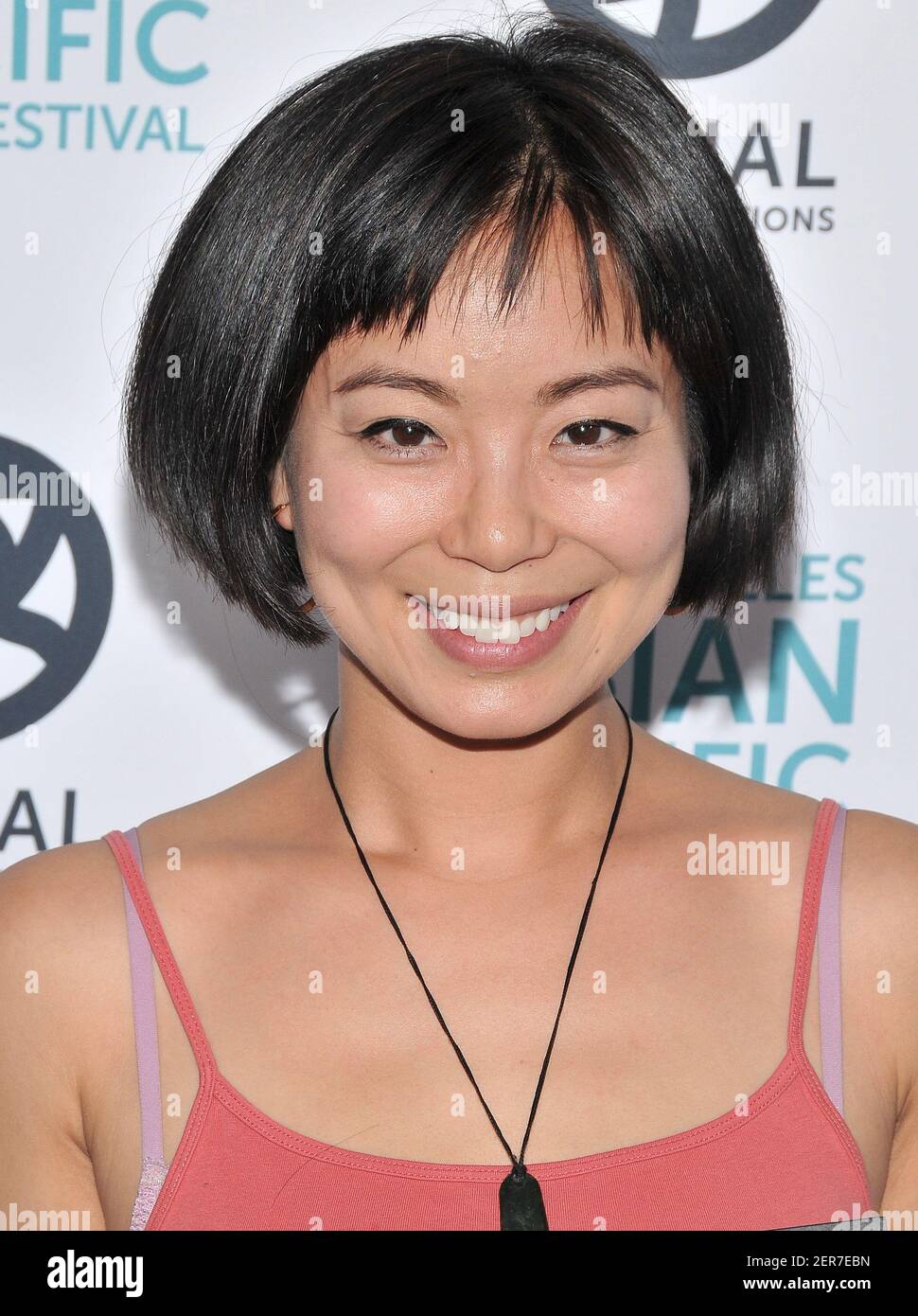 Actress Michelle Ang holding the award in which her film "For Izzy ...