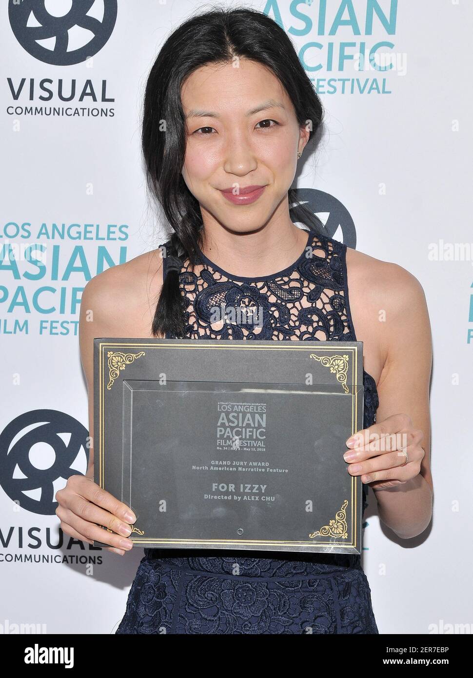 Actress jenny Soo holding the award in which her film "For Izzy" wins ...