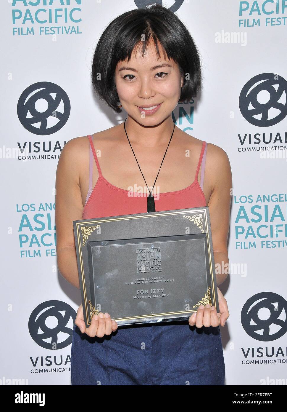Actress Michelle Ang holding the award in which her film "For Izzy ...