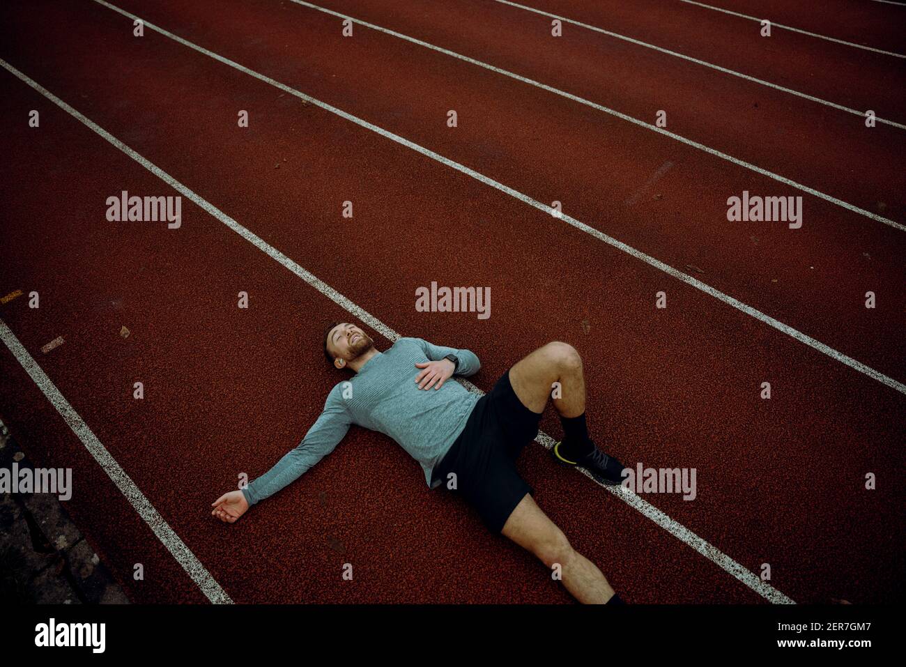 Marathon runner lying down hi-res stock photography and images - Alamy