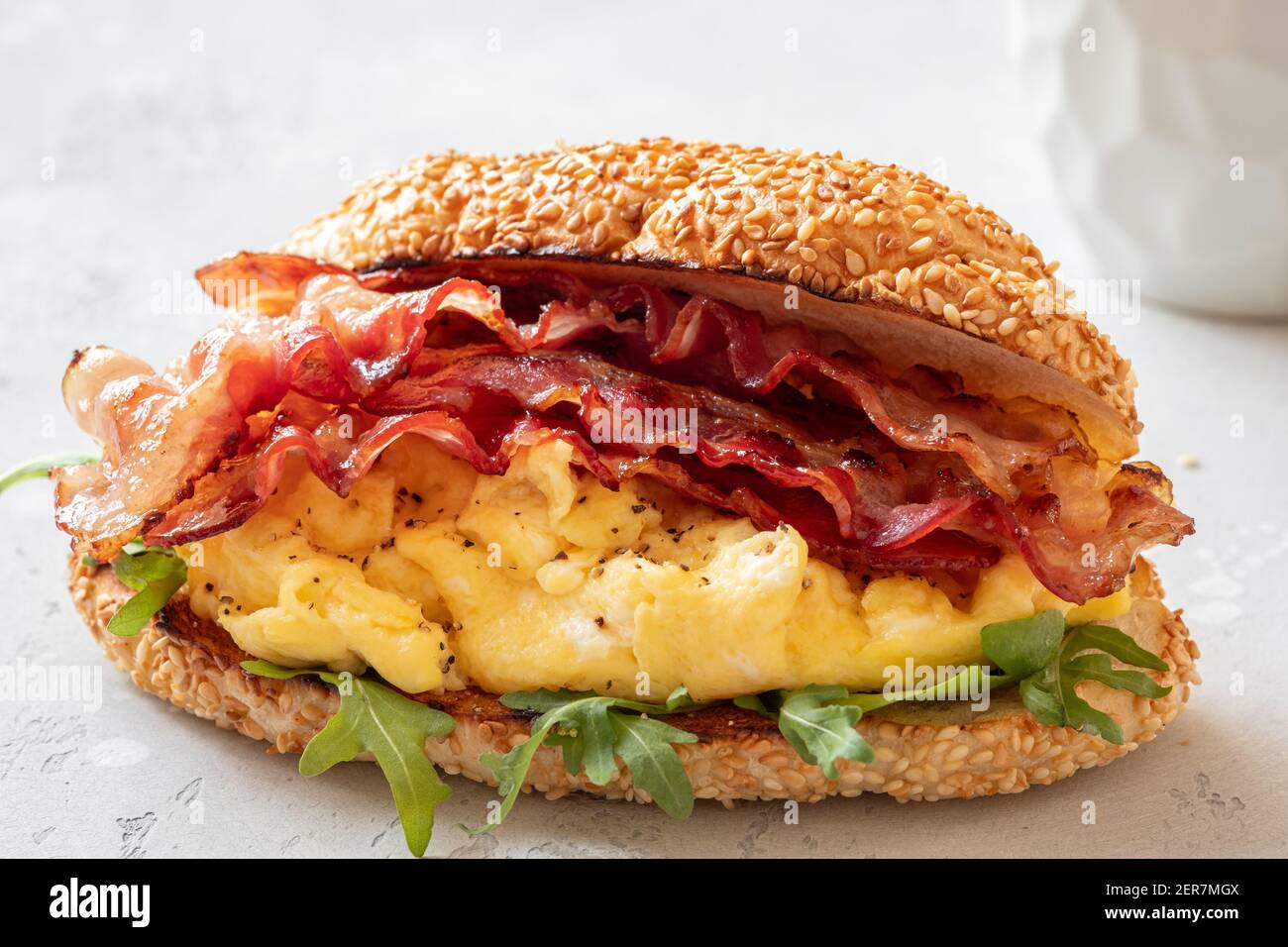 Breakfast bun with scrambled eggs and bacon Stock Photo - Alamy