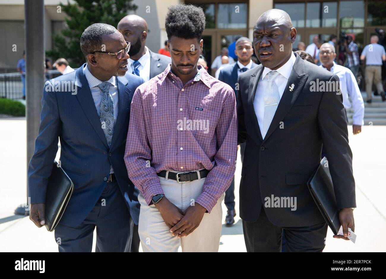 Anthony Wall, center, walks with his attorneys Allen Rogers, left, and ...