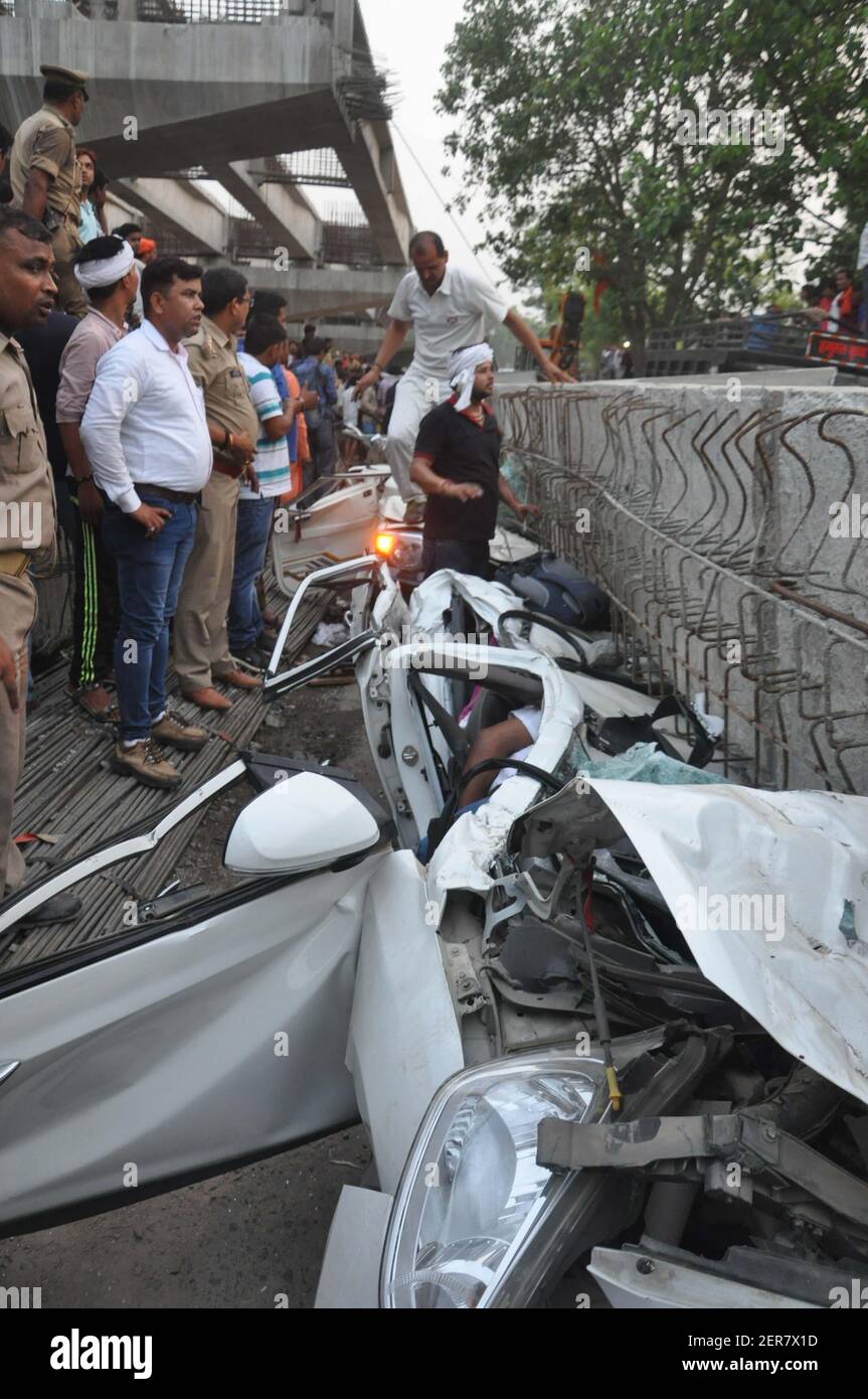 VARANASI, INDIA - MAY 15: Vehicles crushed under the portion of the ...