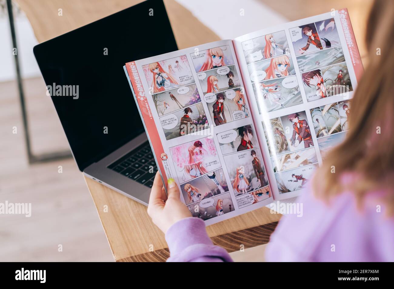Asian girl reading comic book hi-res stock photography and images - Alamy