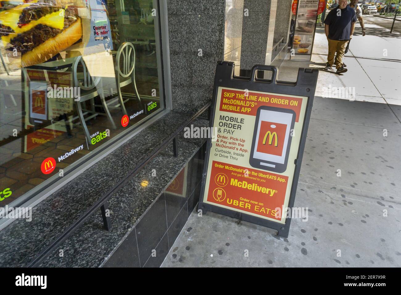 A McDonald's restaurant in New York displays signage promoting their ...