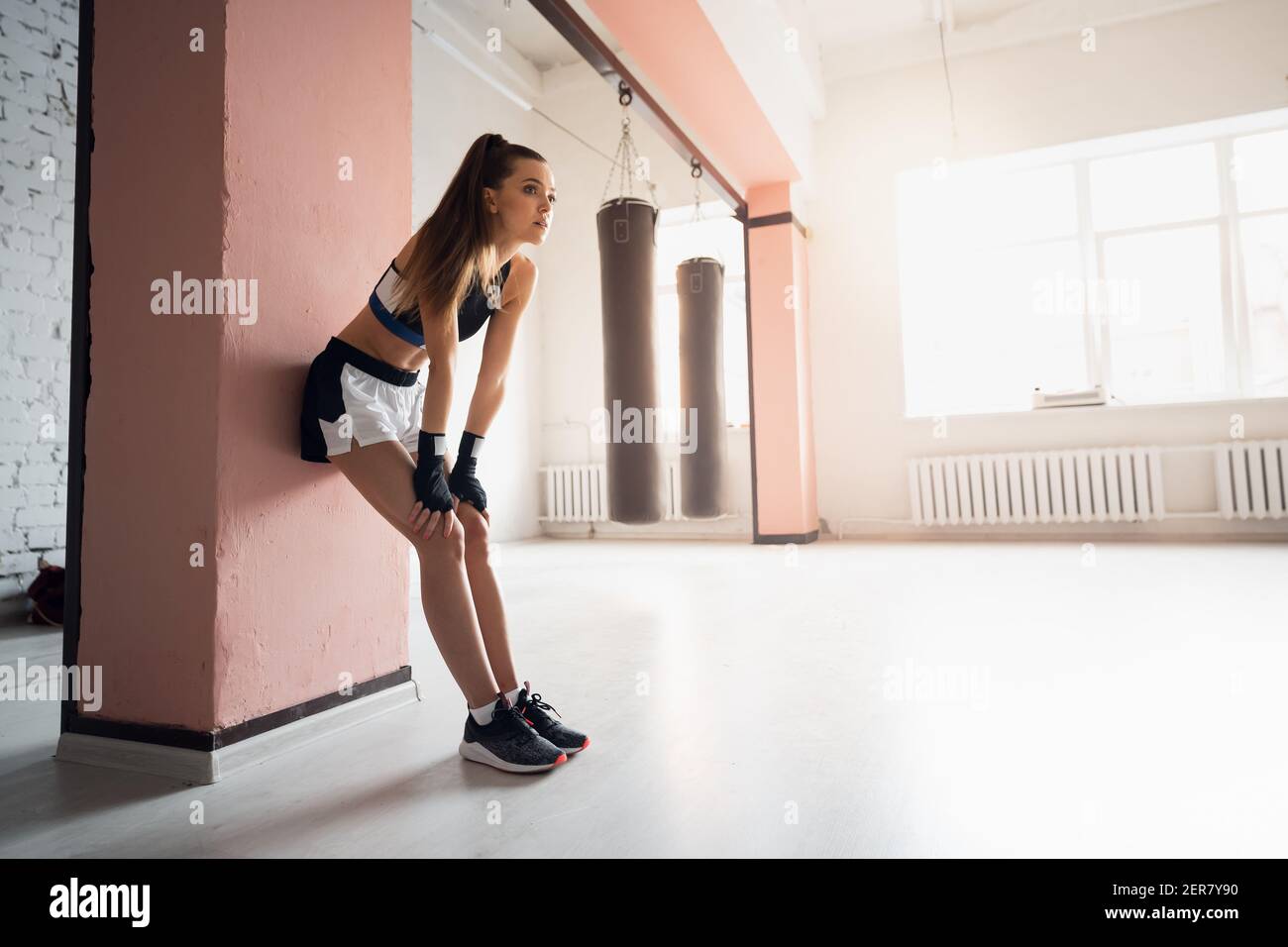 Female fighter exhausted after exercise feeling dehydration. Young ...