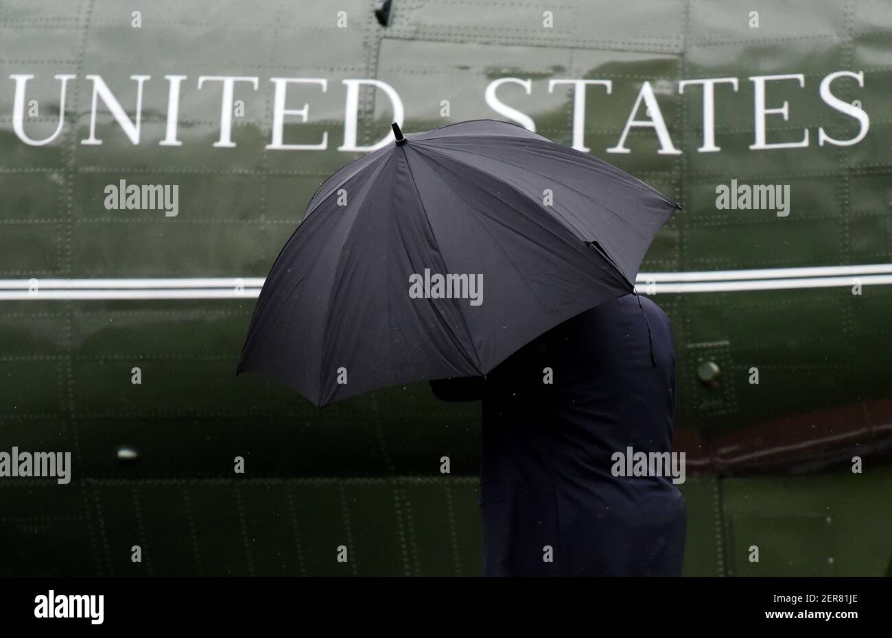 U.S. President Donald Trump walks towards Marine One while departing ...