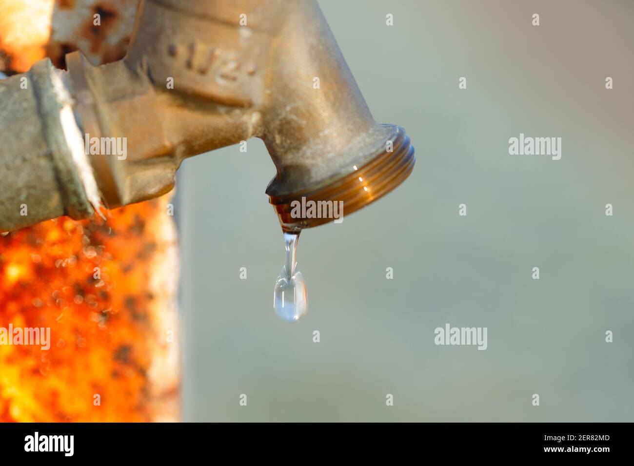 Close up of a dripping outdoor brass tap Stock Photo - Alamy