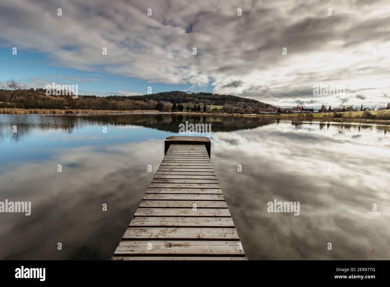 Empty wooden pier on lake. Autumn pond with old jetty. Serenity scenery ...